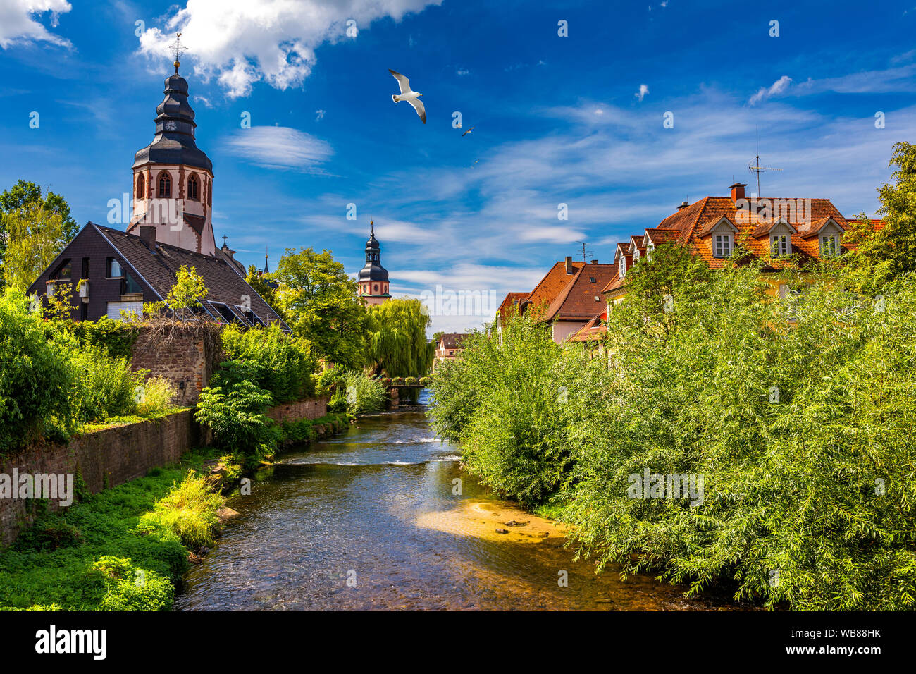 Old city of Ettlingen in Germany with a river and a church. View of a ...