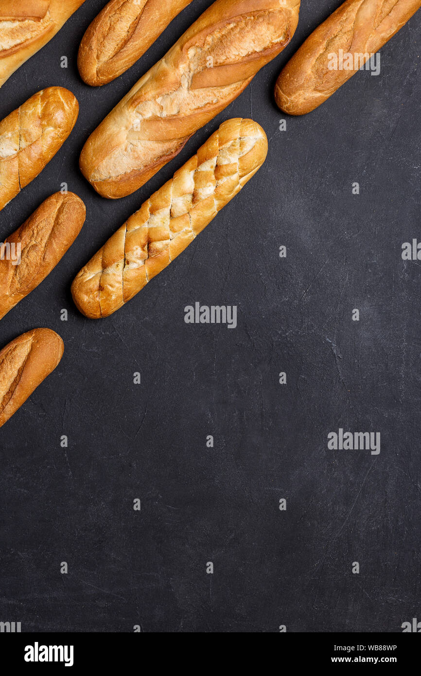 The bread is rows at black background. Concept of banner for text with ...