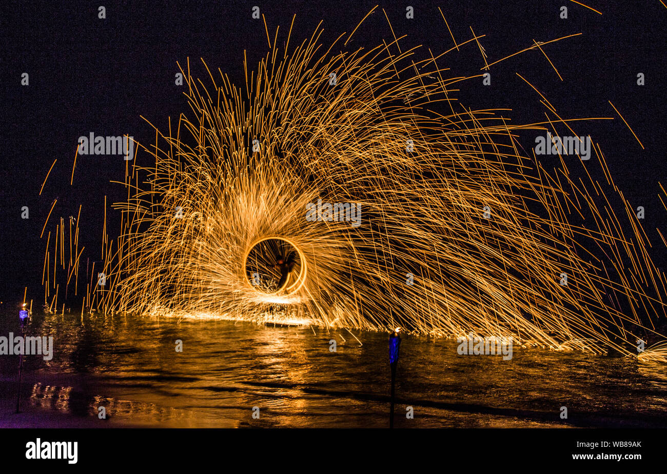 Fire show on the beach in Koh Samui in Thailand Stock Photo - Alamy