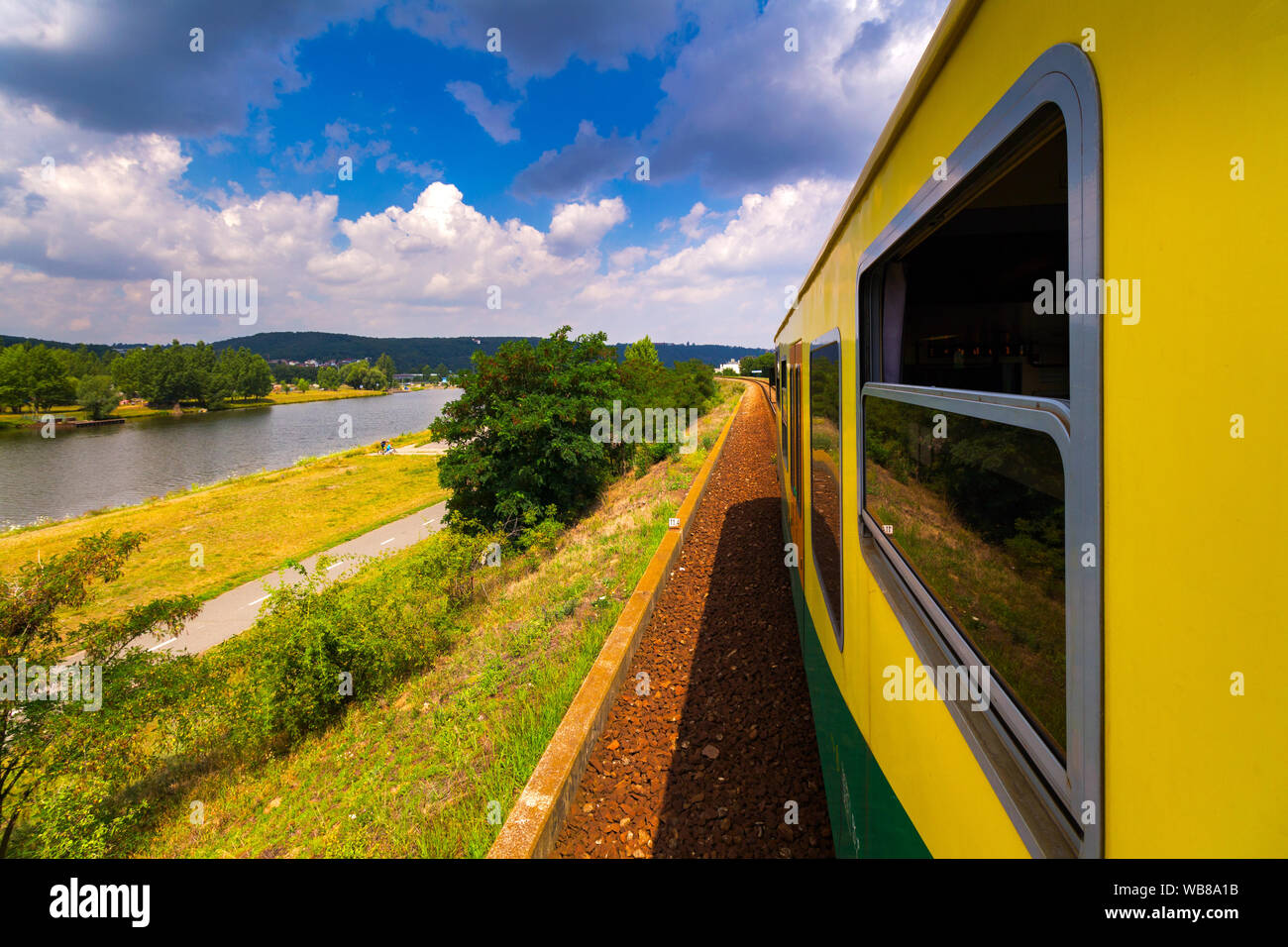 Train ride, view from a window. Old train passing green vegetation ...