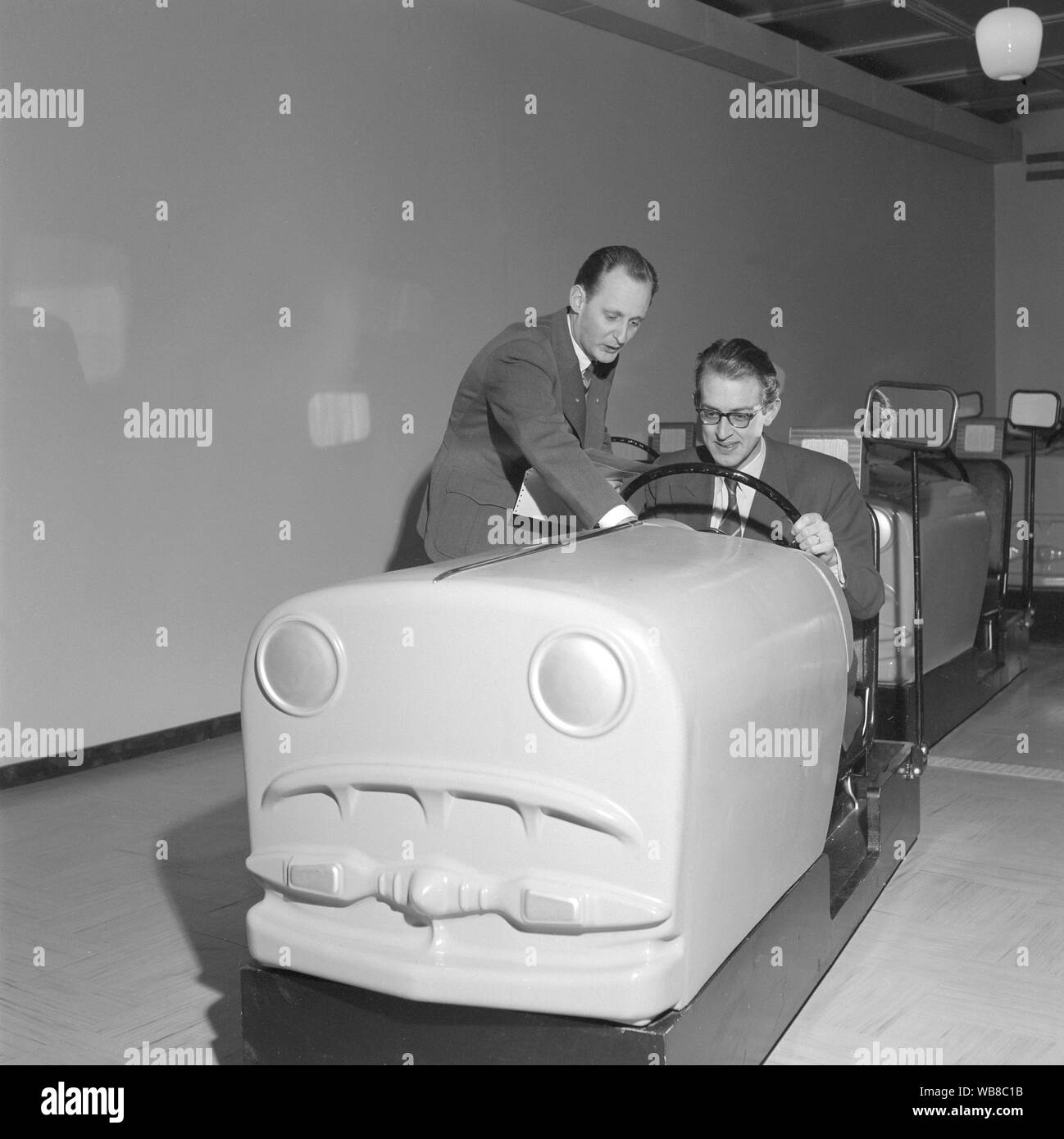 Learning to drive in the 1950s. A young man attends a driving school ...