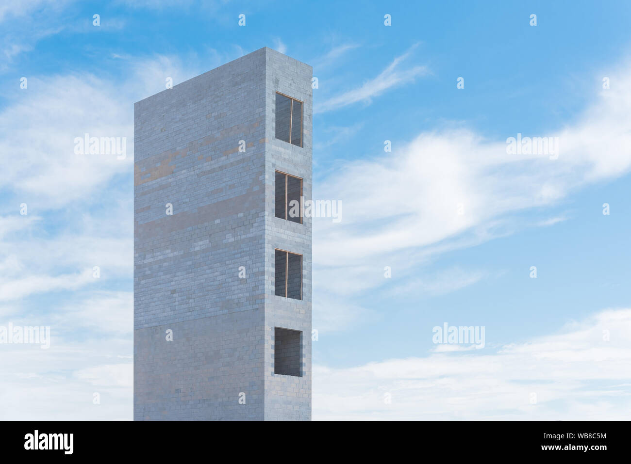 Upward view of elevator tower of new apartment building under ...