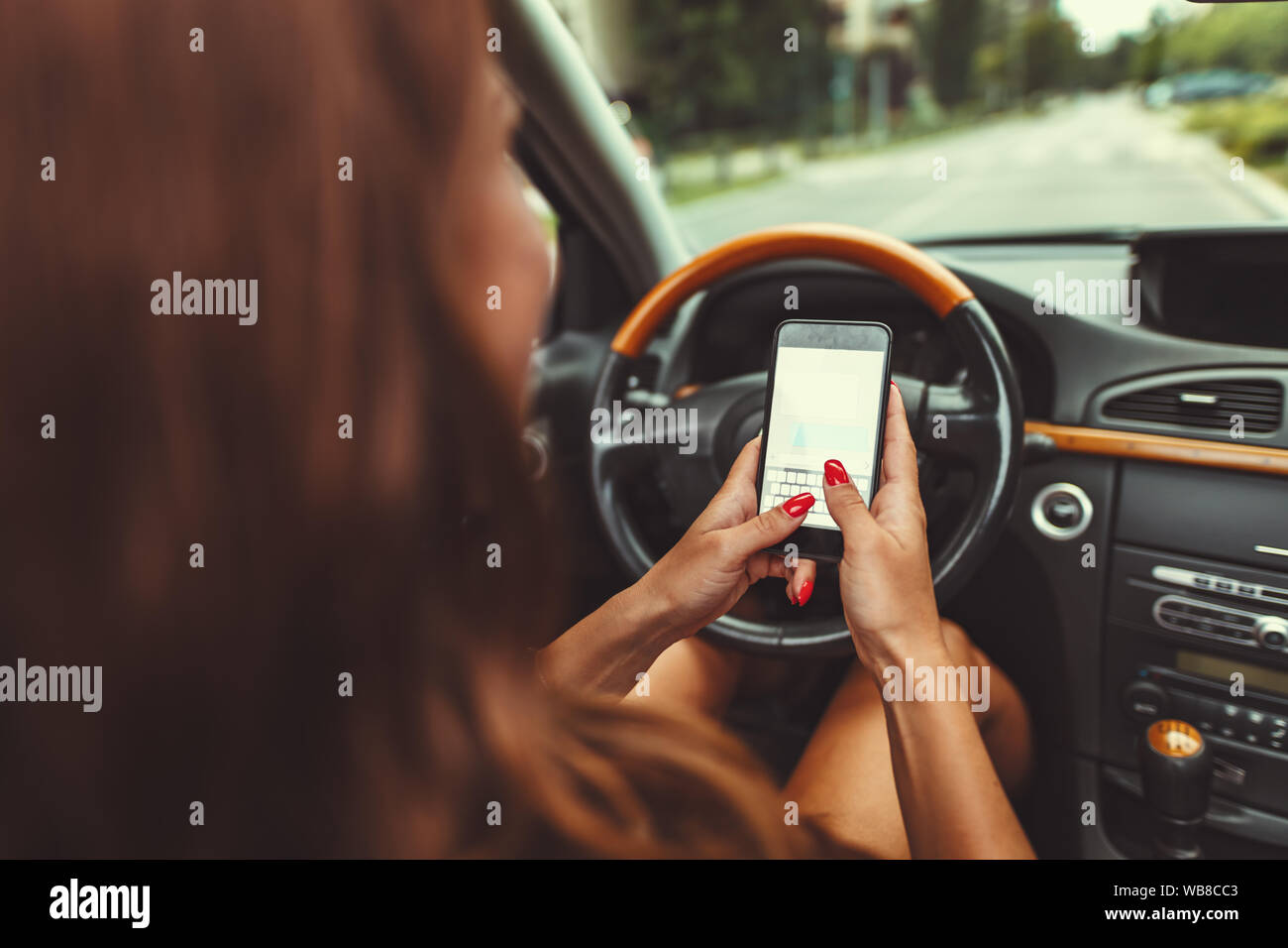 Woman and texting and rear view hi-res stock photography and images - Alamy
