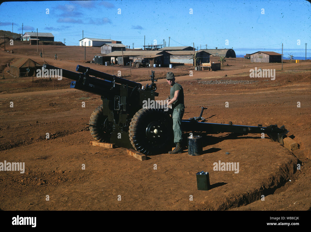 A US Army servicemen works to clean a Howitzer artillery gun at a base ... A US Army servicemen works to clean a Howitzer artillery gun at a base ...
