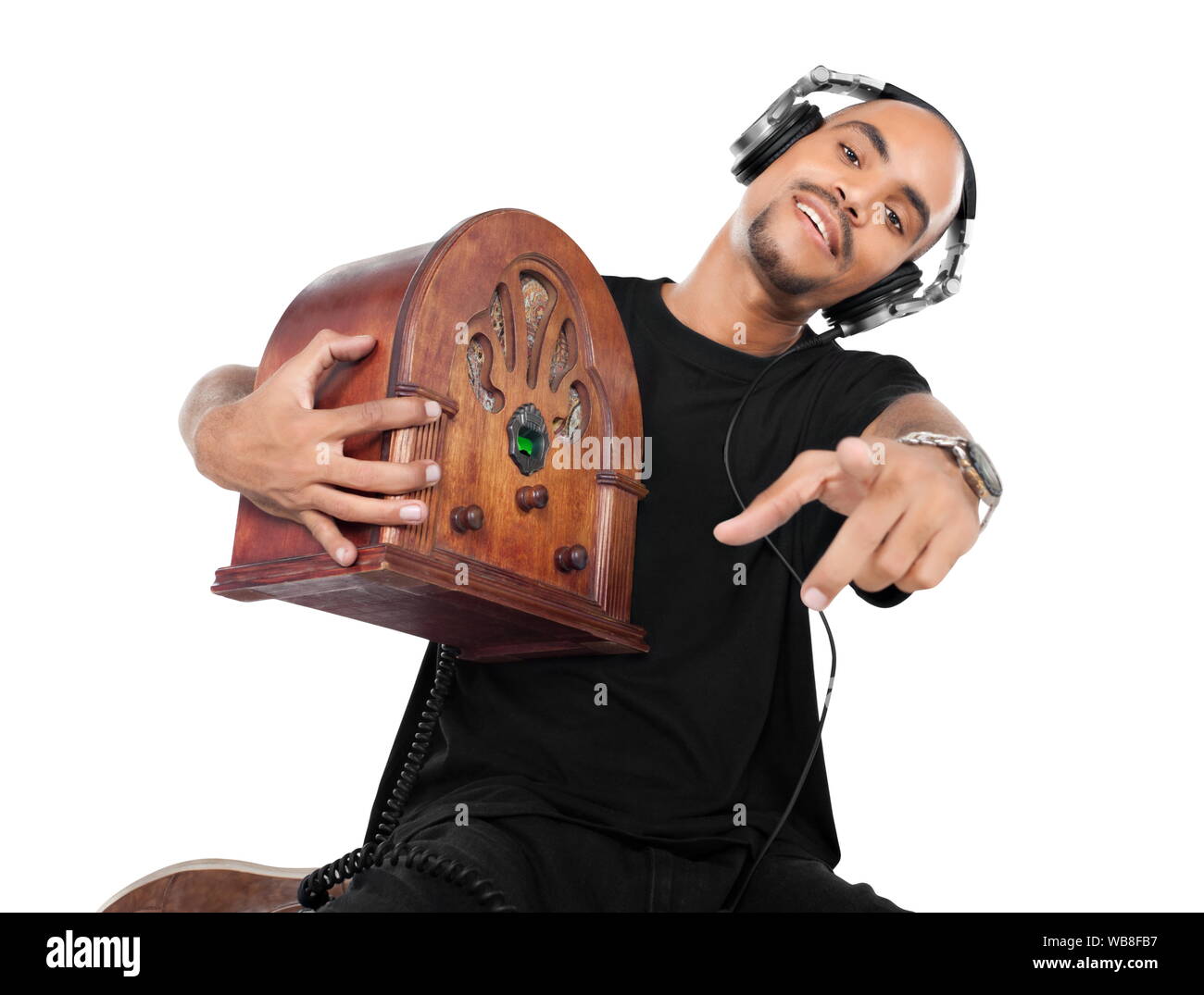 African musician singer with headphones holding a vintage radio Stock ...