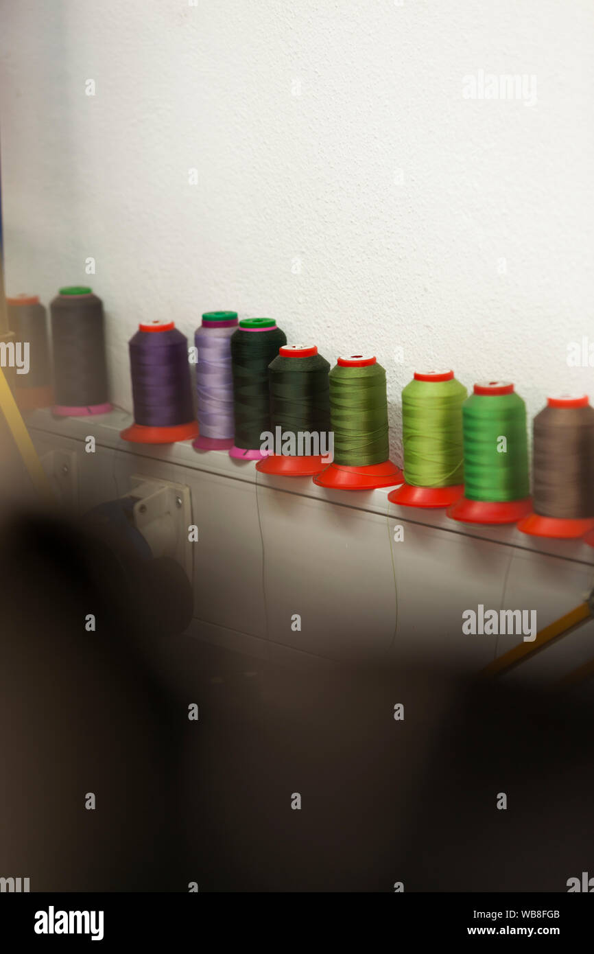 Pile of sewing thread spools hi-res stock photography and images - Alamy