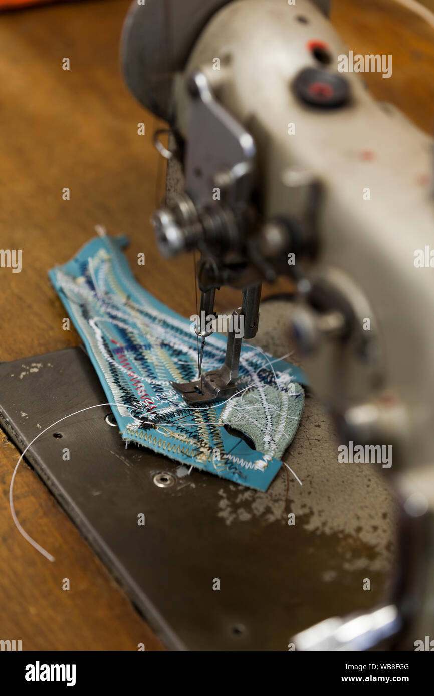 iron sewing machine is stitching on a peace of leather Stock Photo - Alamy