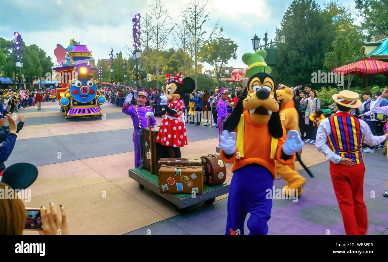 Tourists watch the parade at Shanghai Disneyland at the Shanghai Disney ...