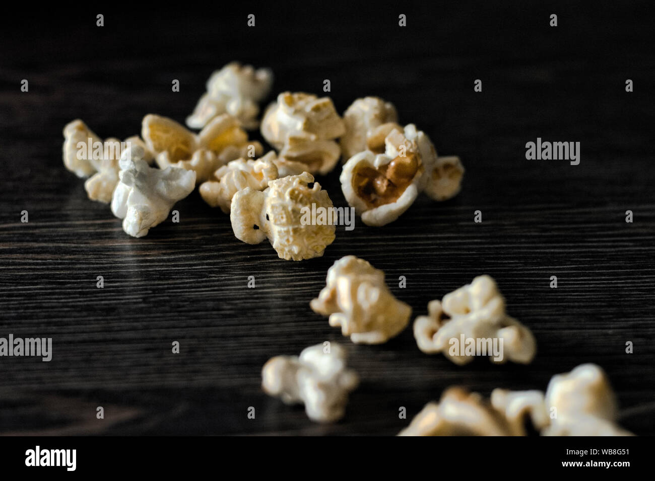 popcorn on wood table. Selective focus Stock Photo - Alamy
