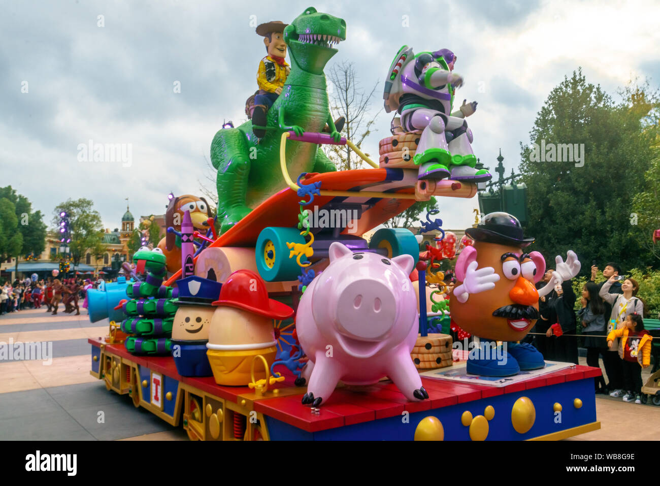 Tourists watch the parade at Shanghai Disneyland at the Shanghai Disney ...