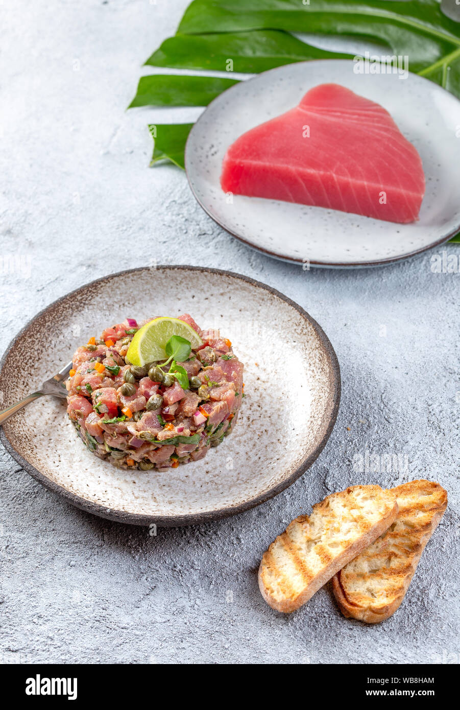 Tuna fish TARTAR tartare on gray plate Stock Photo - Alamy