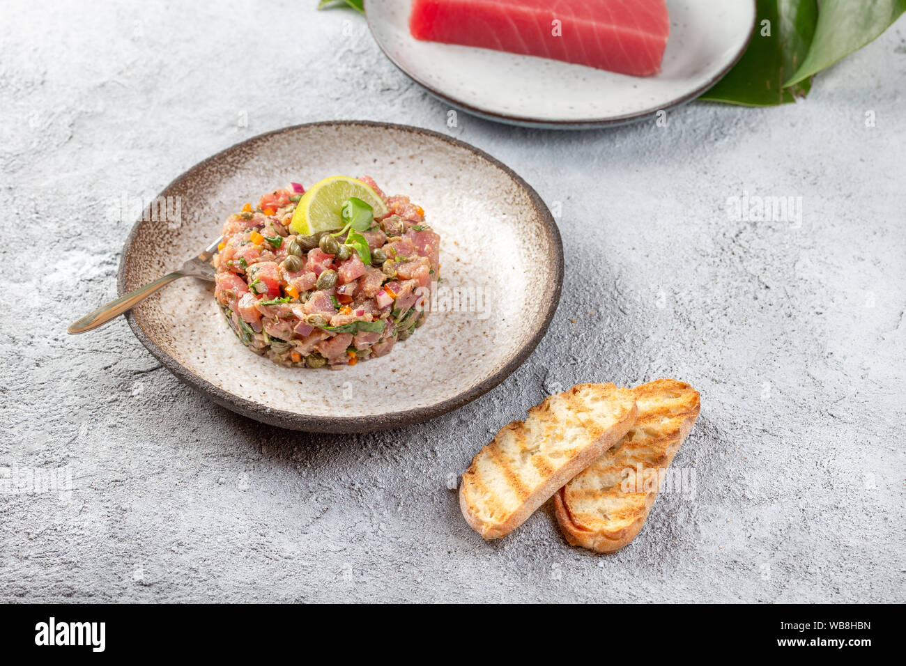 Tuna fish TARTAR tartare on gray plate Stock Photo - Alamy