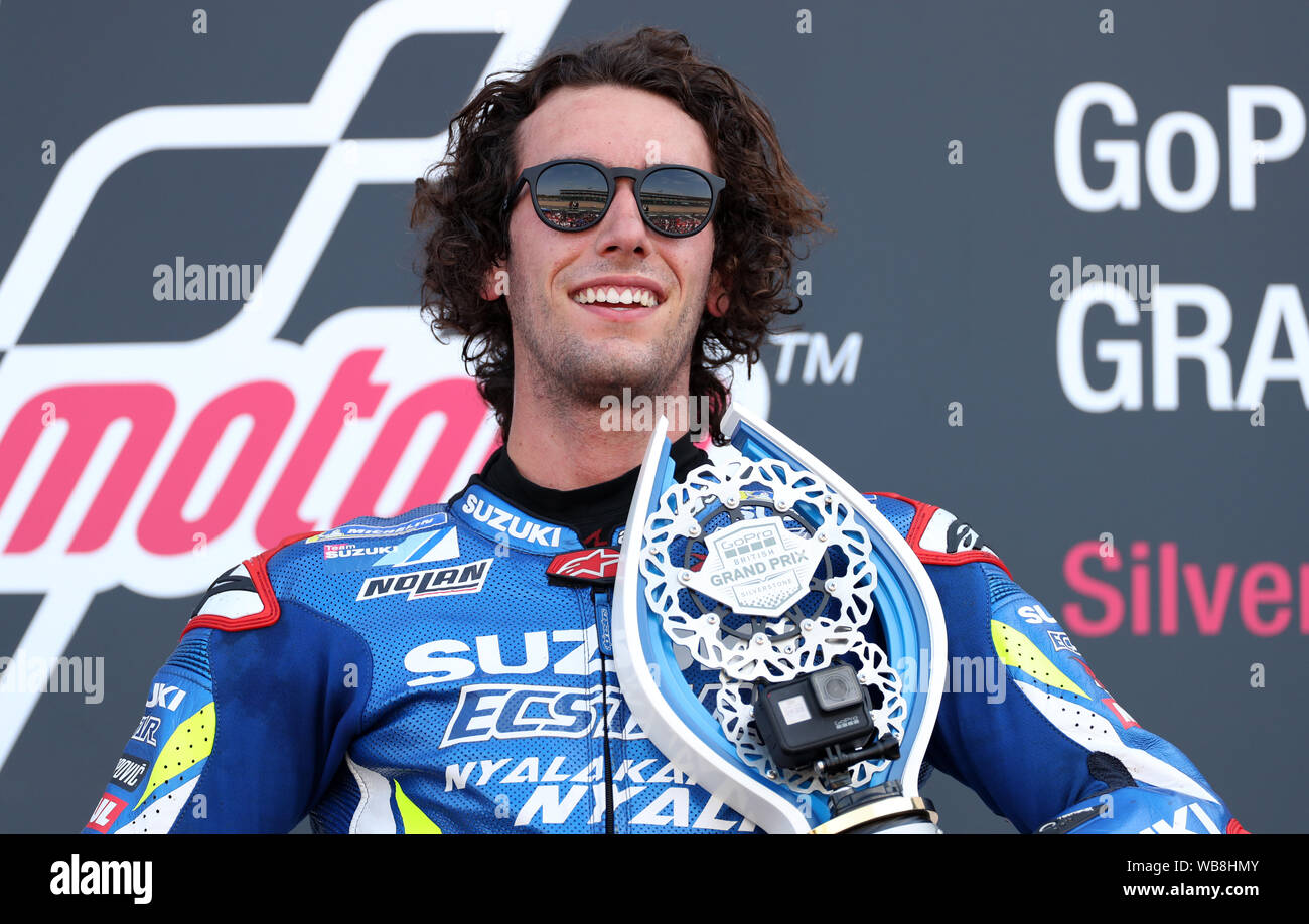 Suzuki's Alex Rins celebrates victory on the podium during the GoPro ...