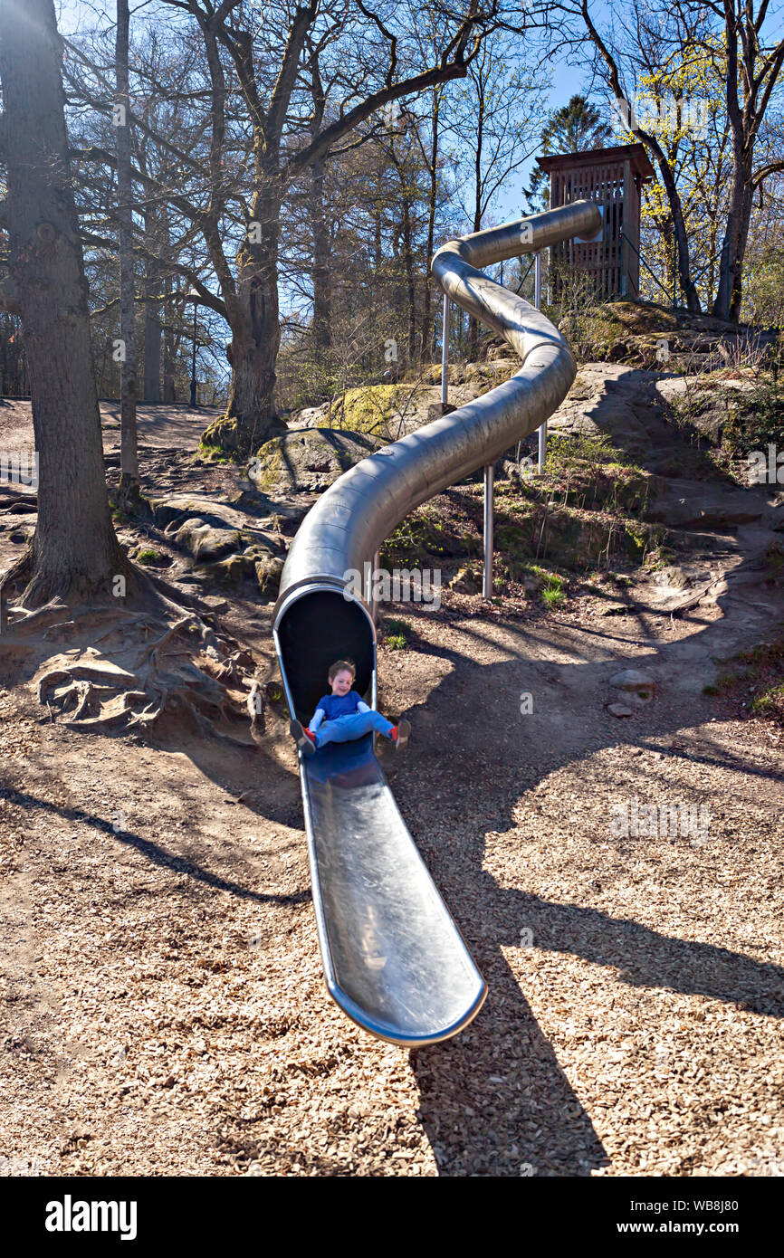 Boy on a slide in Slottskogen park, Goteborg, Sweden Stock Photo - Alamy