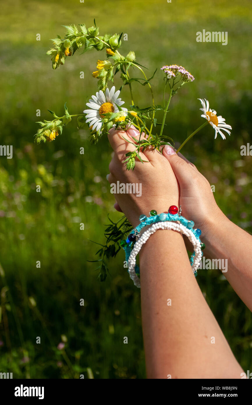 Flowers in girls hands hi-res stock photography and images - Alamy