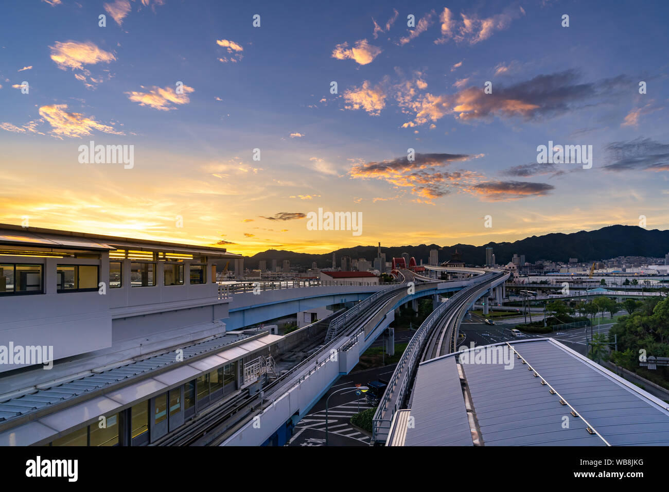 sunset monorail track and highway red bridge to Kobe downtown Hyogo ...