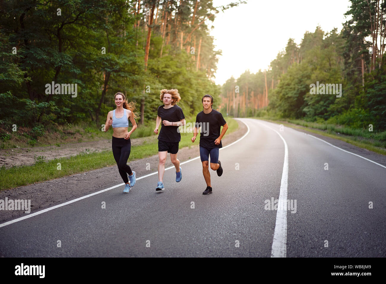 Three Men Running In Marathon Stock Photos & Three Men Running In ...
