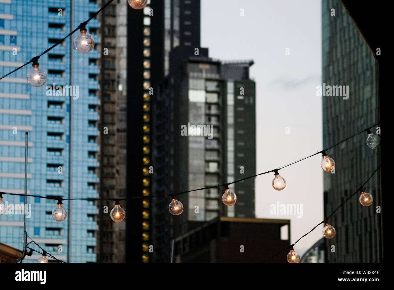 A hanging string of lights at Queen Victoria Night Market with the ...