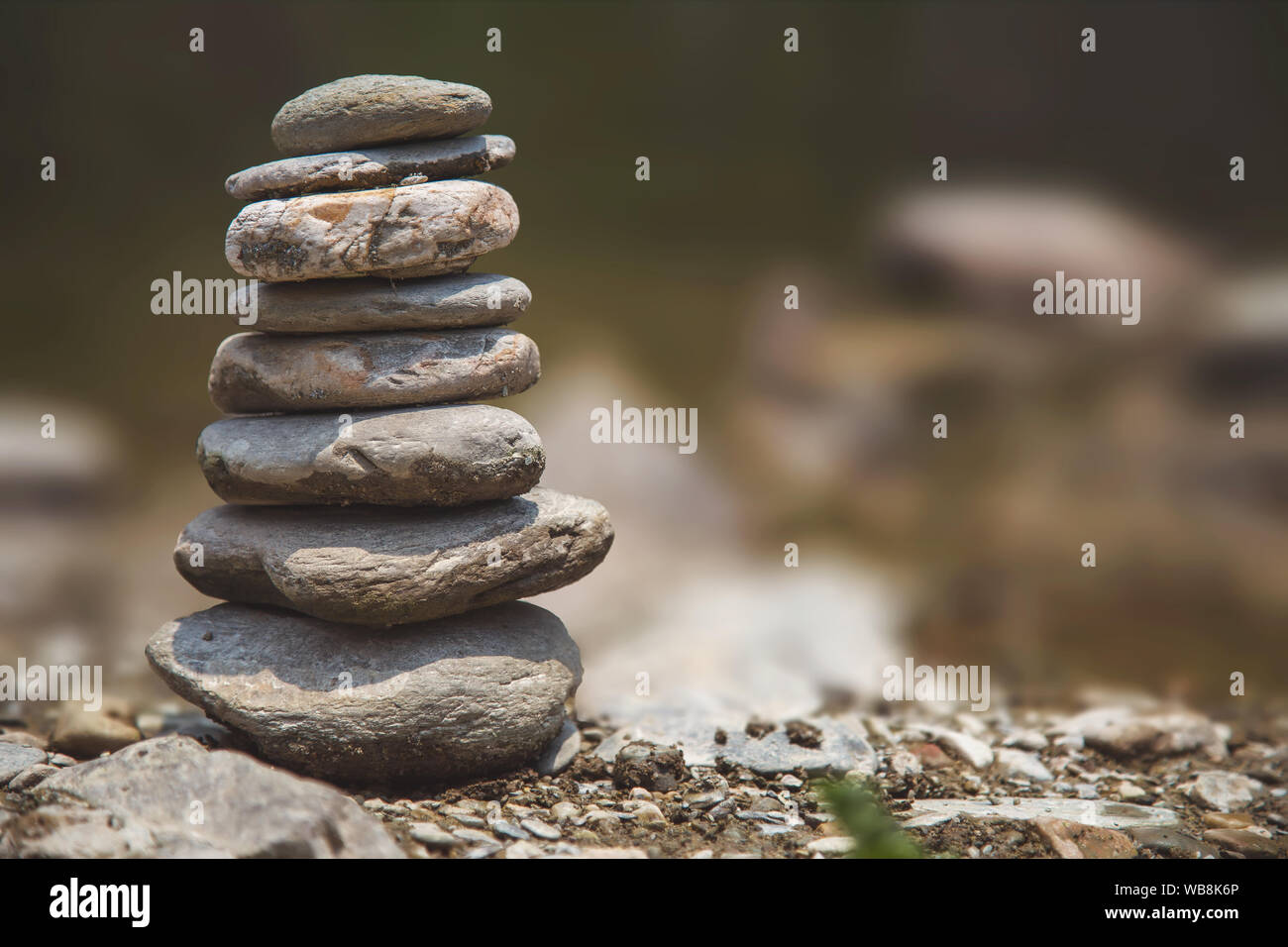 River stones Balanced on the Rock. Pyramid of river stones on of one ...