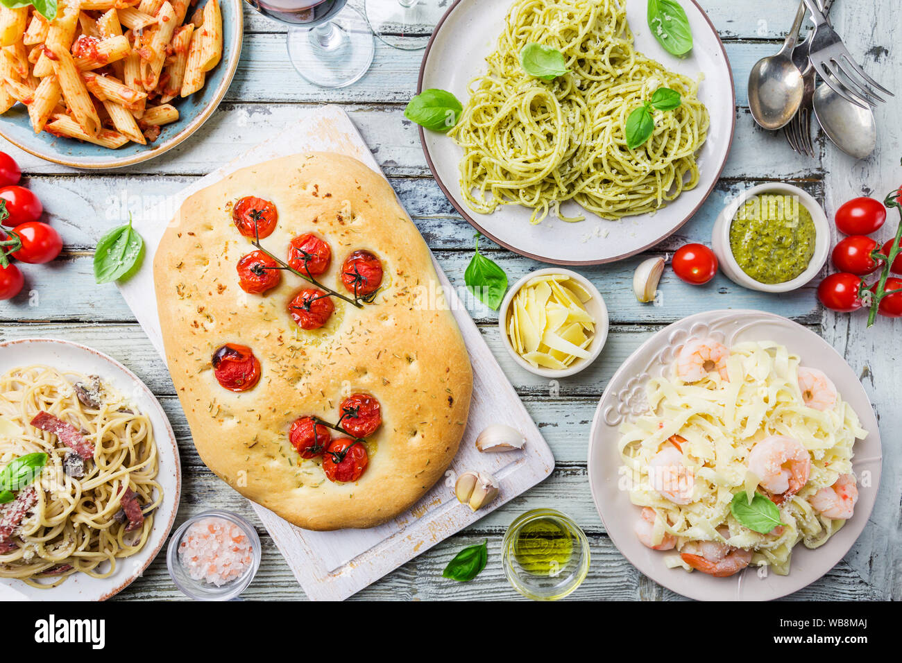 Concepts of Italian food. Table with several plates of pasta with ...