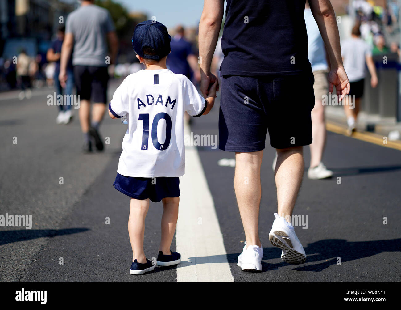 A young Tottenham Hotspur's fan arrives at the stadium prior to the ...