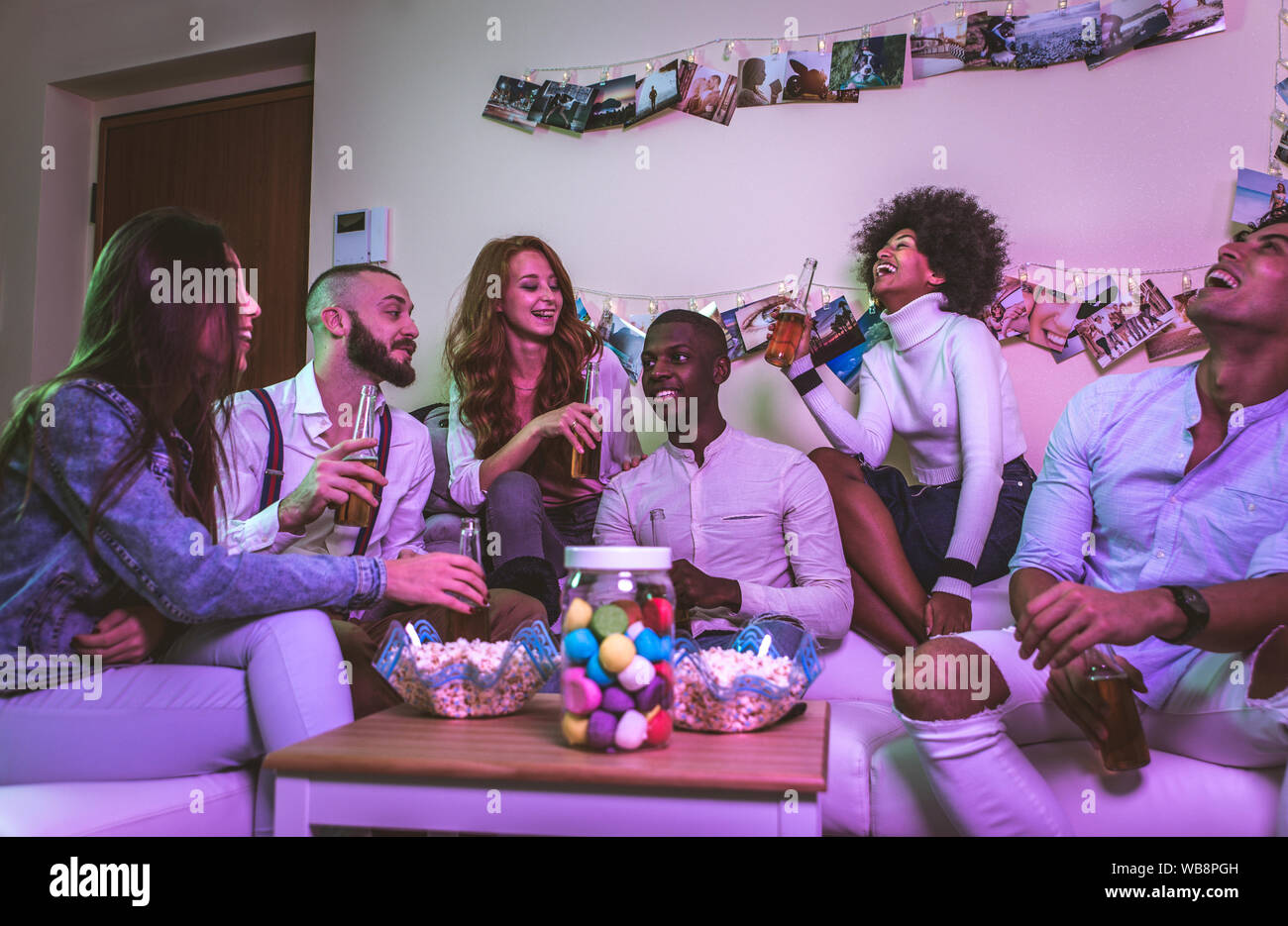 A group of young people celebrating and making party at home Stock ...