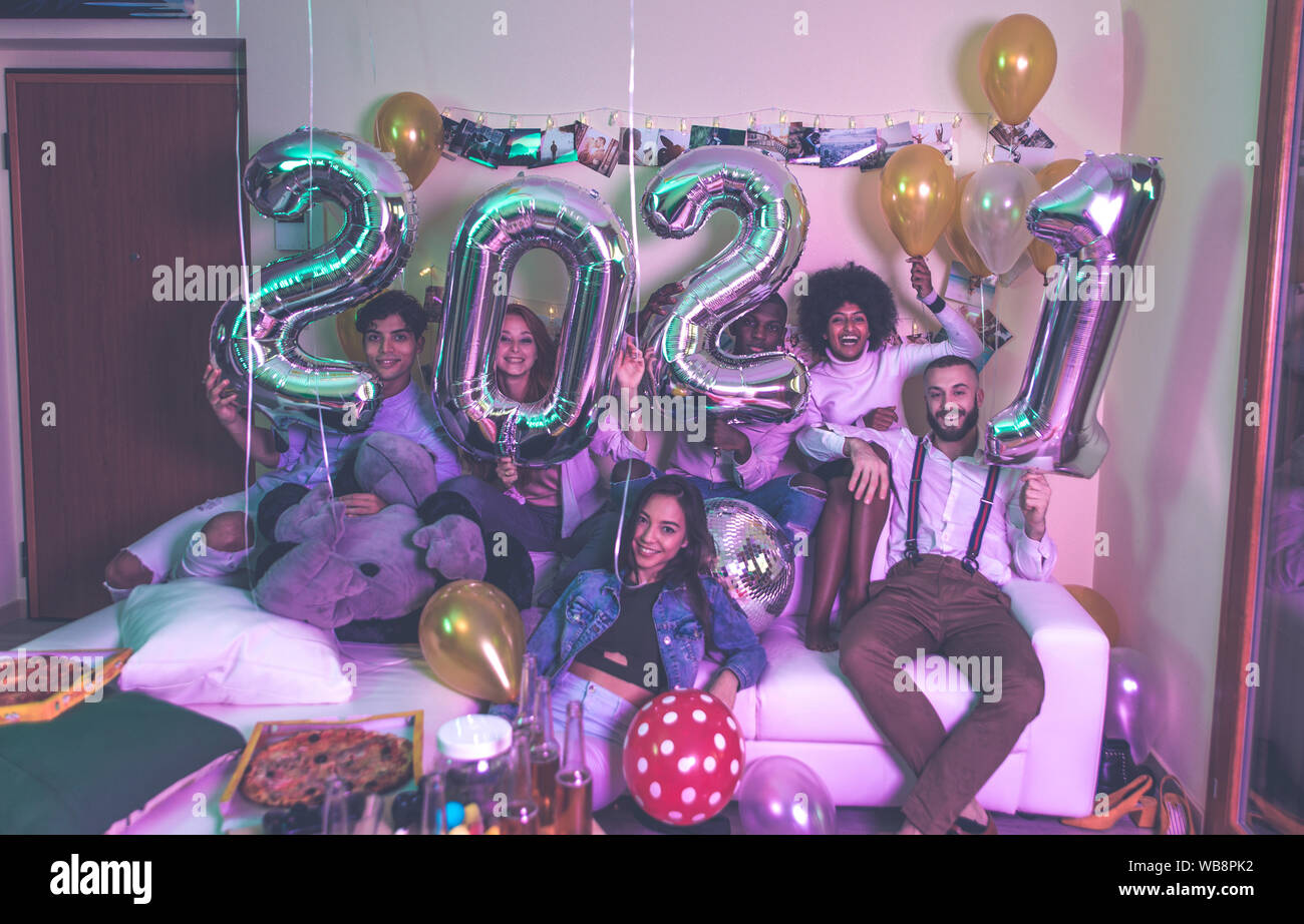 A group of young people celebrating and making party at home Stock ...