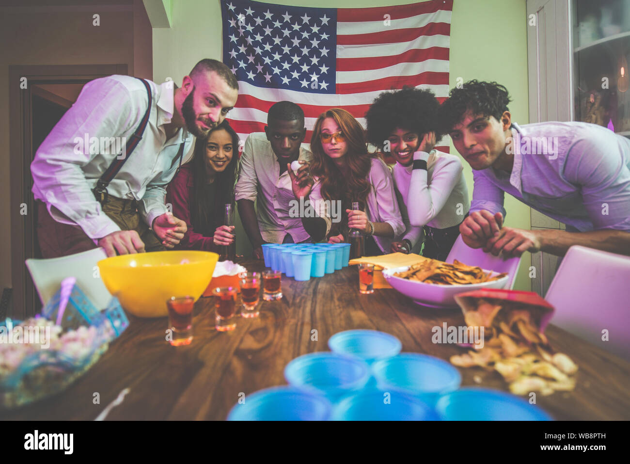 A group of young people celebrating and making party at home Stock ...