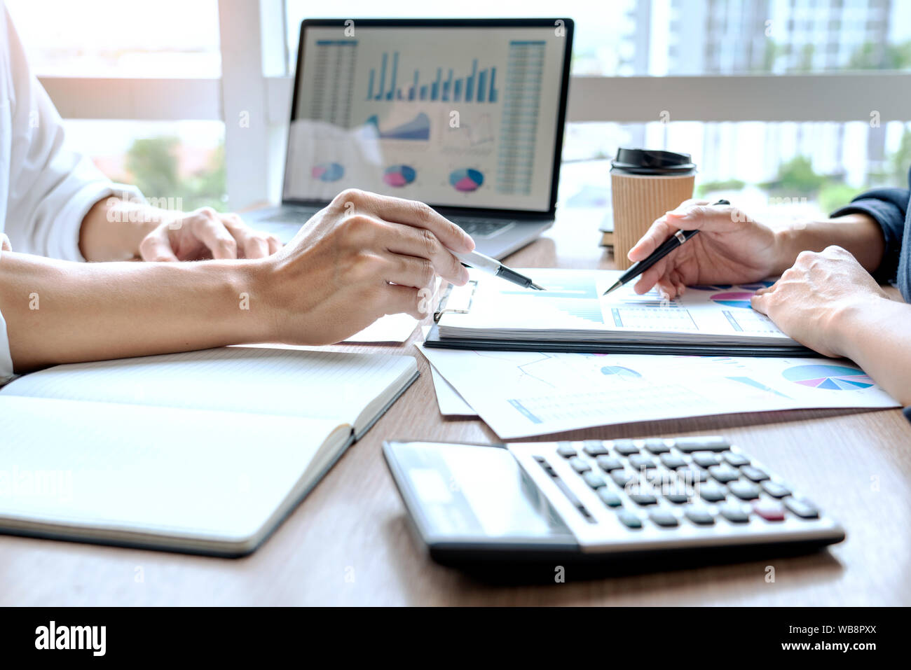 Teamwork concept, Business executives discussing document work at ...