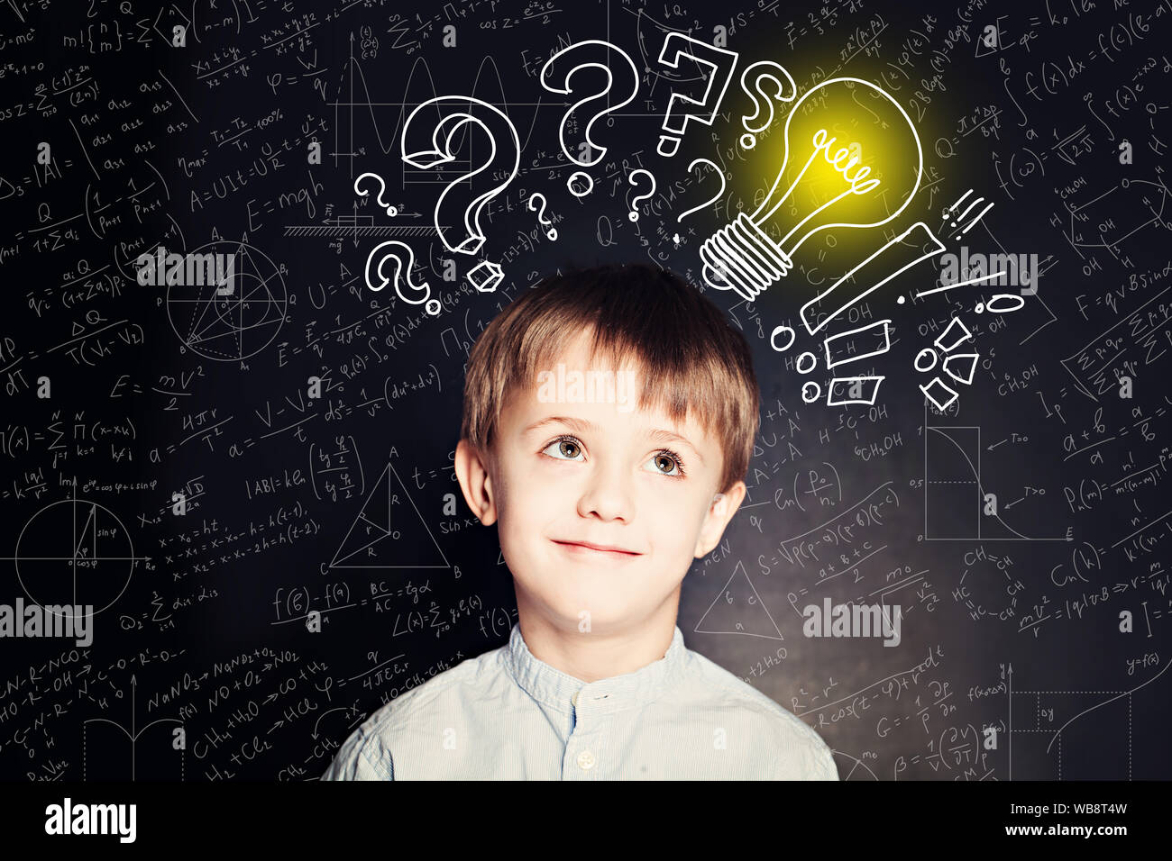 School boy with lightbulb on background. Science idea concept with ...