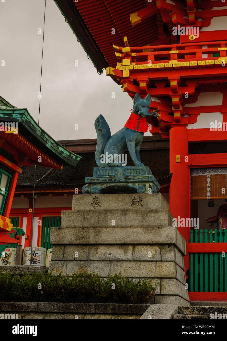 detailed craftwork of a fox as a mythical creature in Fushimi Inari ...