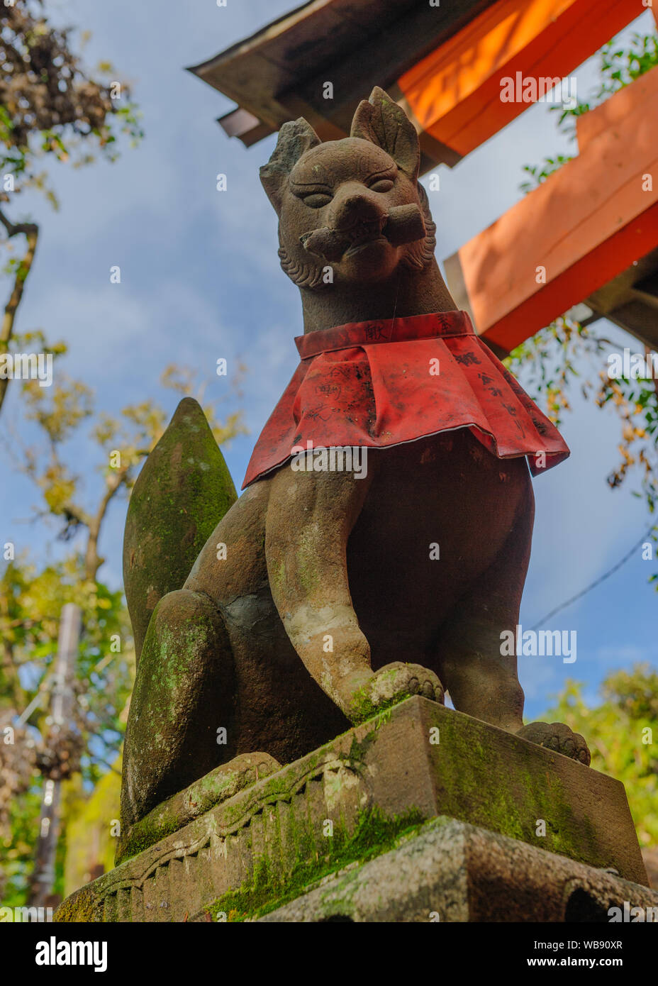 detailed craftwork of a fox as a mythical creature in Fushimi Inari ...