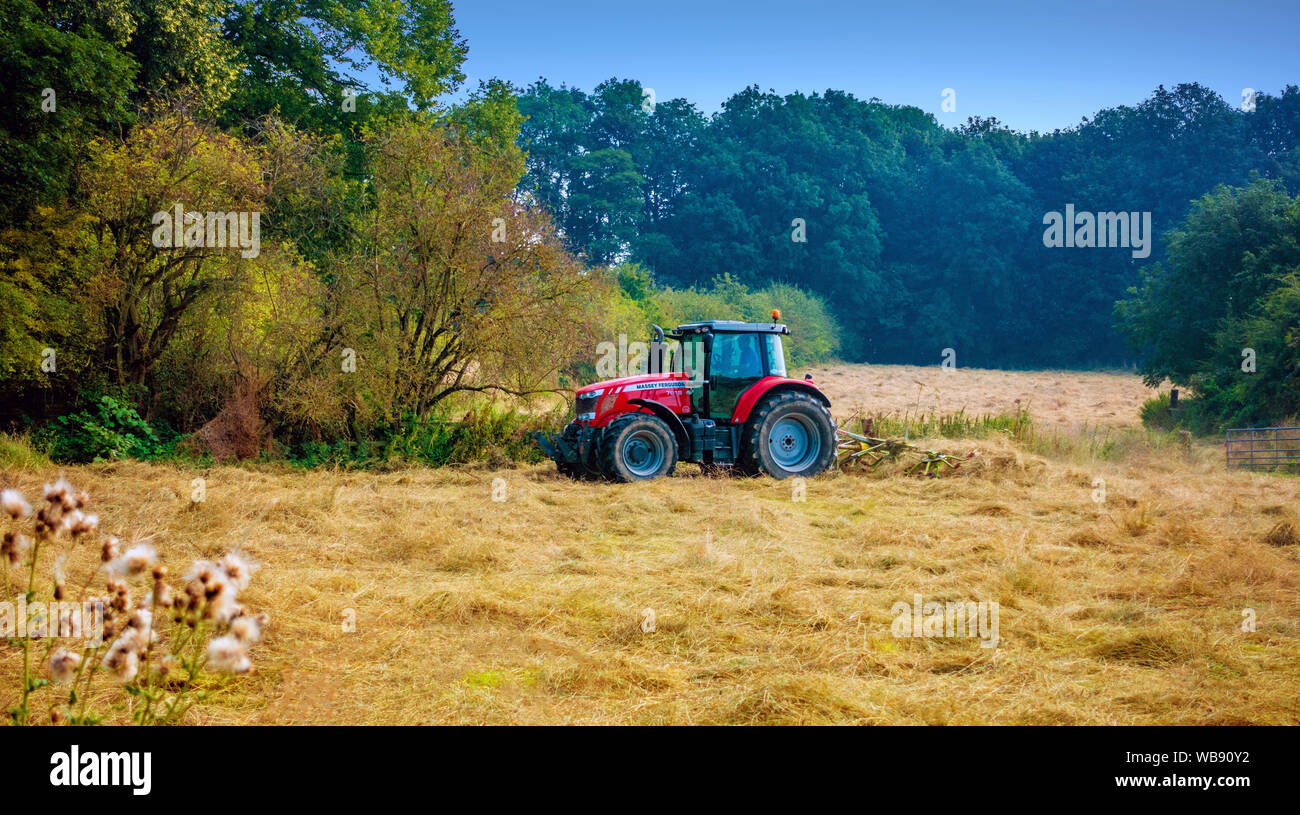 English farm tractor turning grass Stock Photo - Alamy