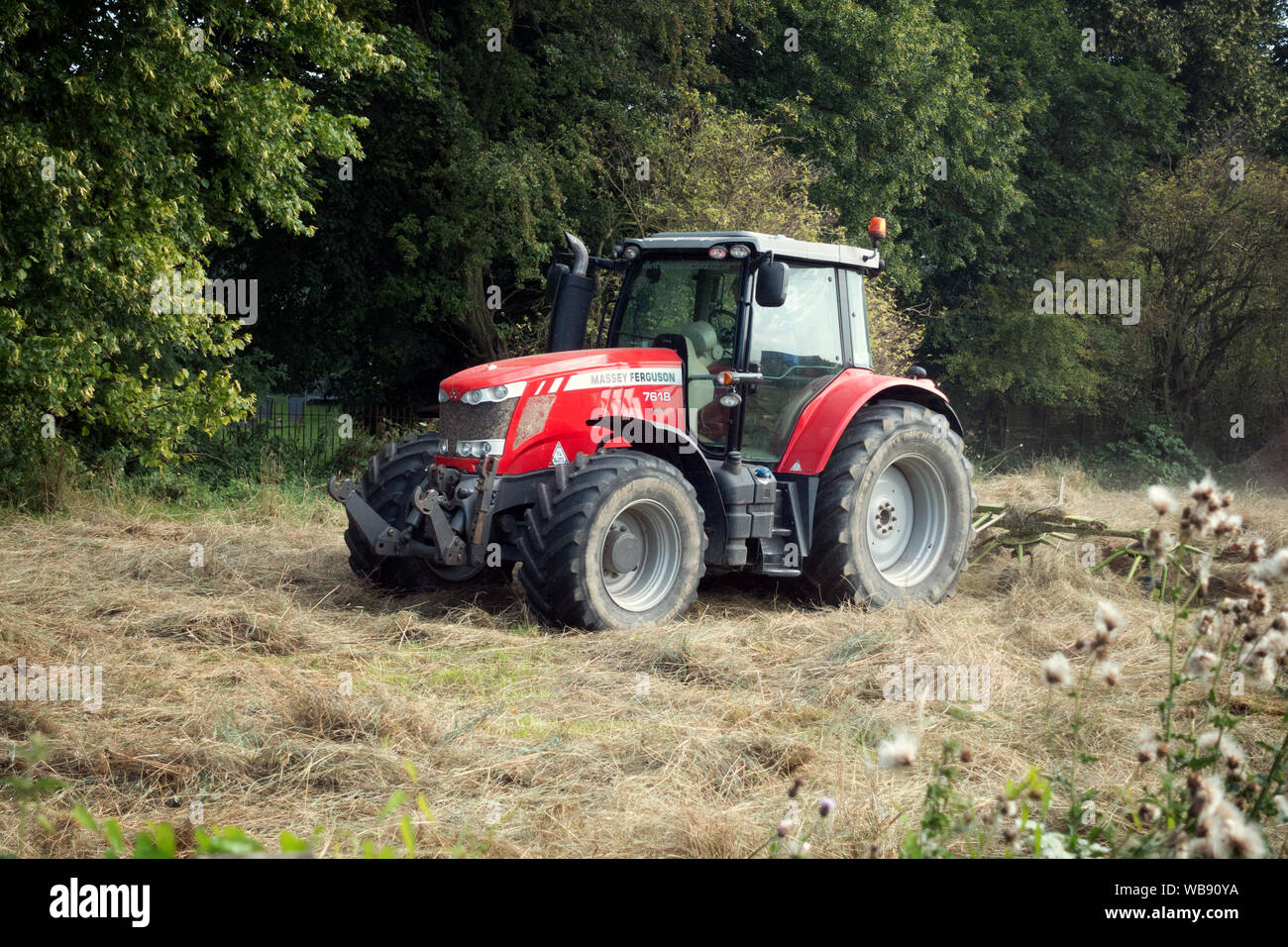 English farm tractor turning grass Stock Photo - Alamy
