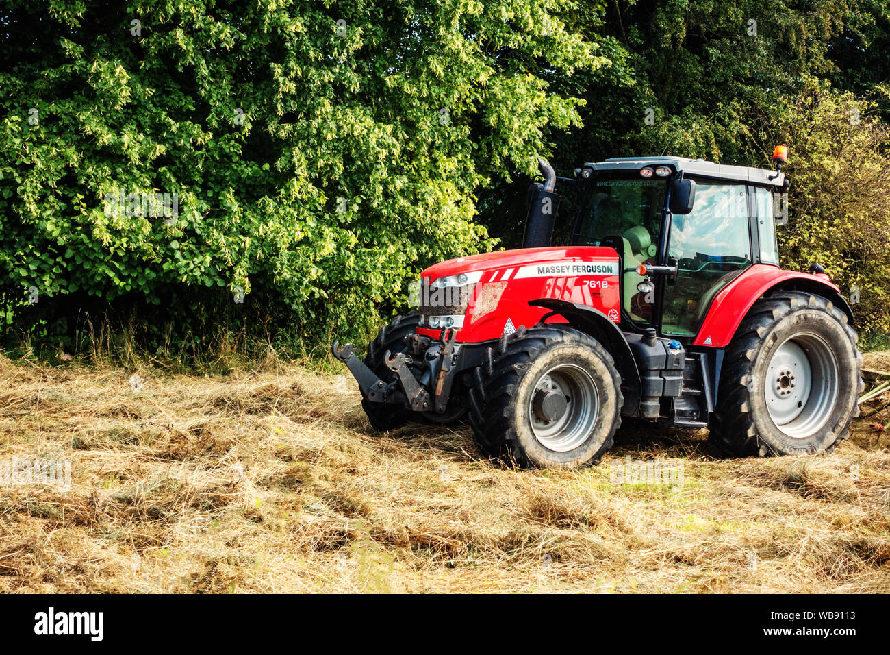 English farm tractor turning grass Stock Photo - Alamy