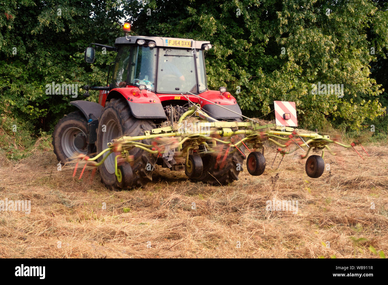 English farm tractor turning grass Stock Photo - Alamy