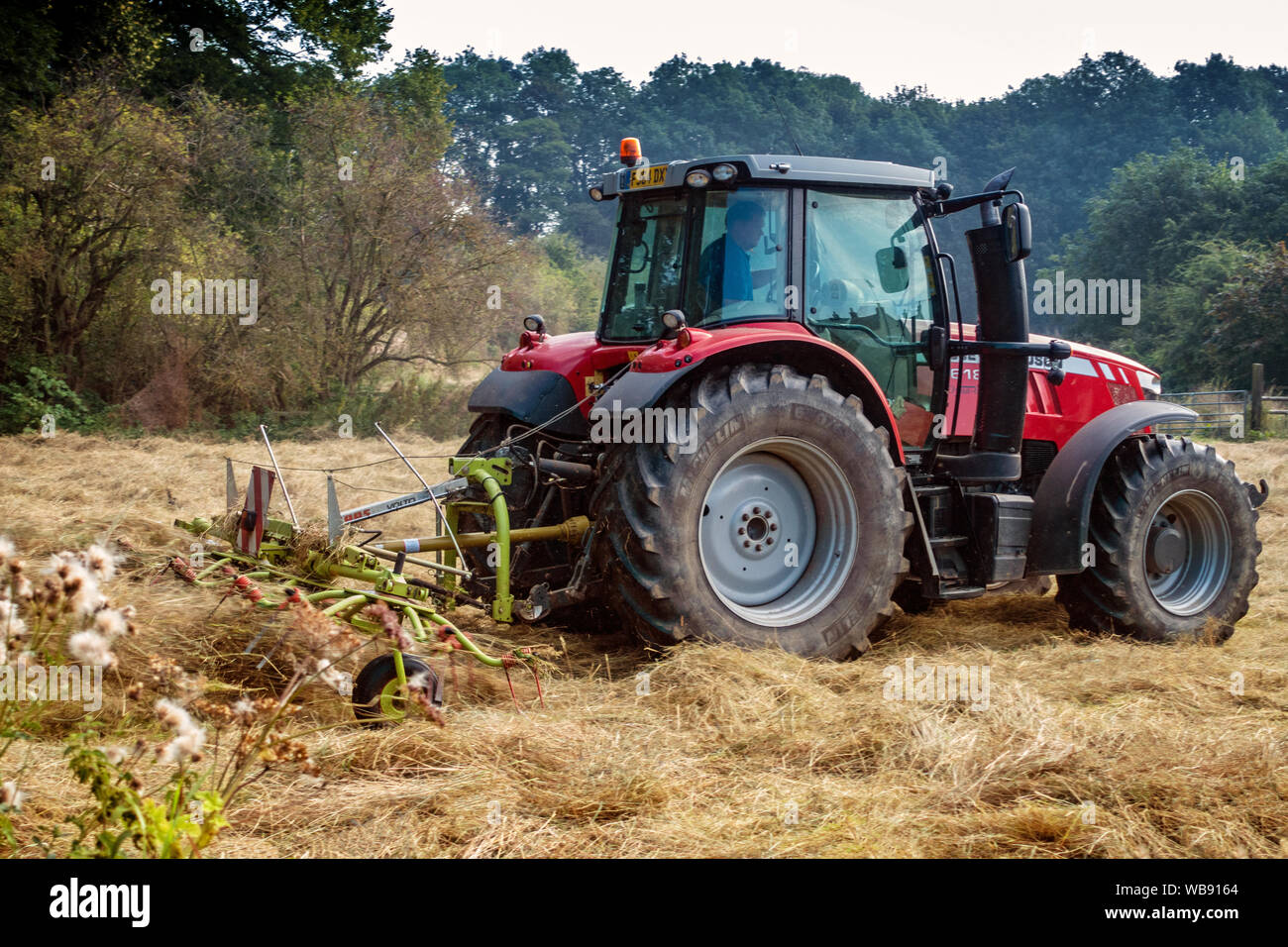 English farm tractor turning grass Stock Photo - Alamy
