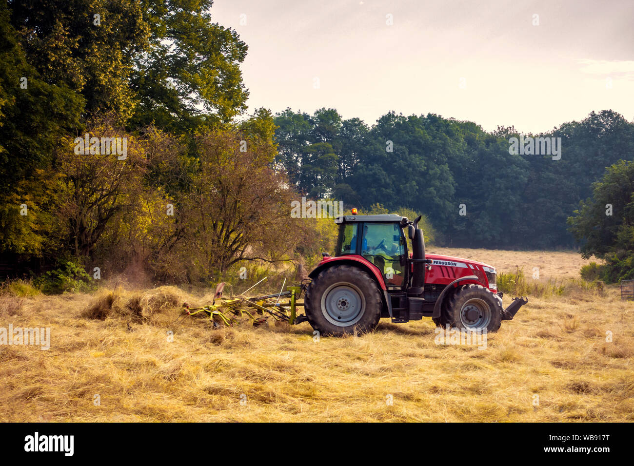 English farm tractor turning grass Stock Photo - Alamy