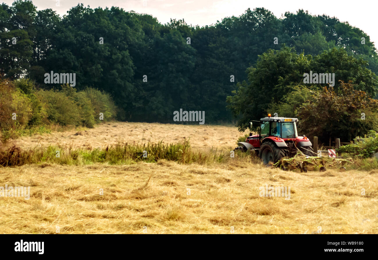 English farm tractor turning grass Stock Photo - Alamy
