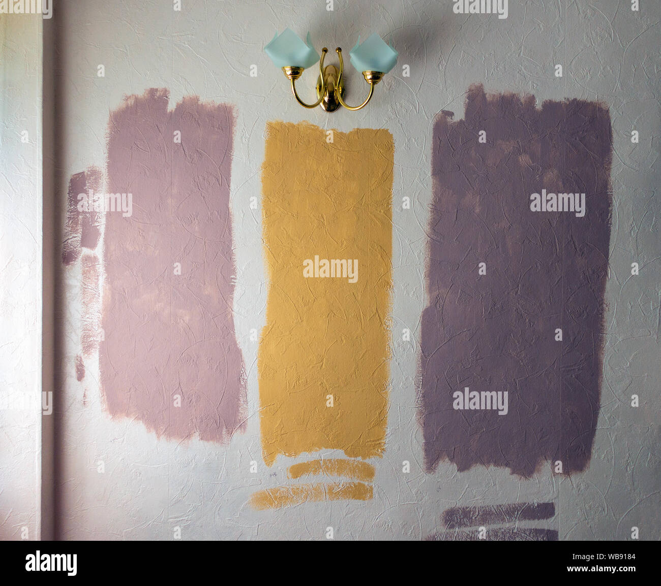 paint colour test sample panels on house interior wall Stock Photo - Alamy