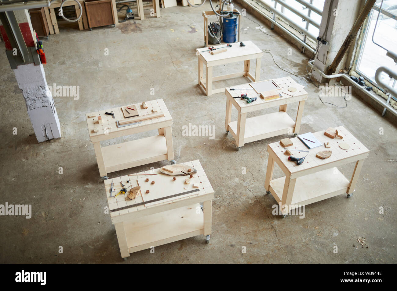 Wide angle background of workstations in industrial woodworking shop ...