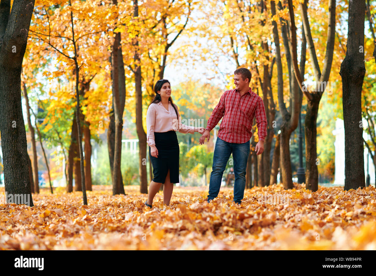 Man couple autumn walk fallen leaves trees hi-res stock photography and ...