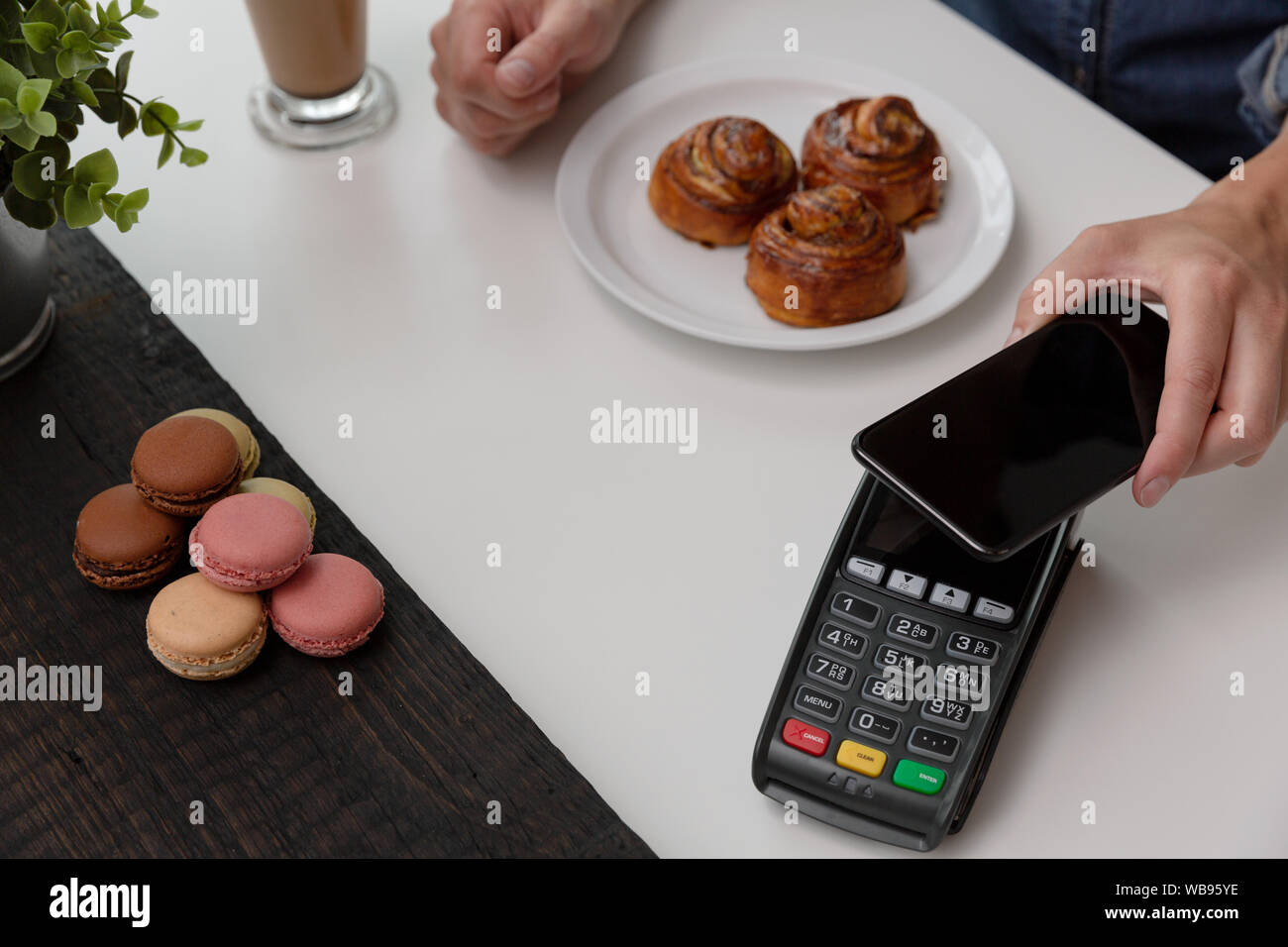 Customer making wireless or contactless payment using smartphone, nfc ...