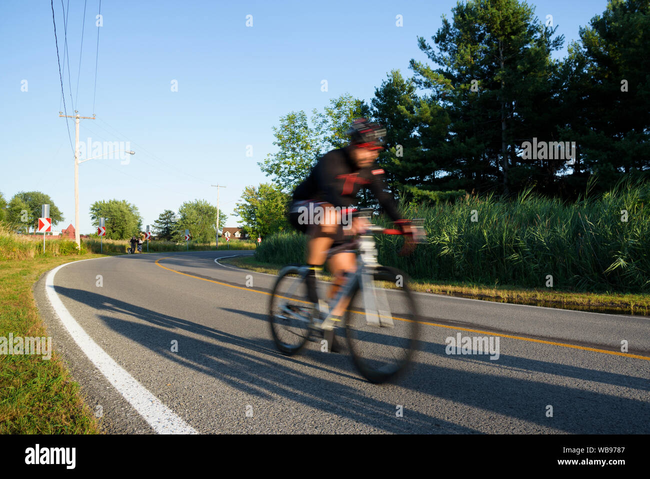 Cyclist riding his road bike, motion blur Stock Photo - Alamy