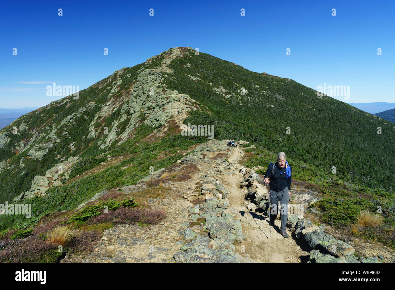 Hiker coming down from hi-res stock photography and images - Alamy