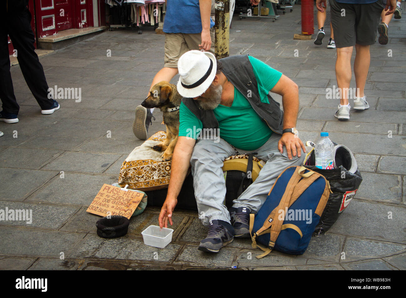 Paris, France - July 7, 2018: Homeless and his dog are sitting on the ...