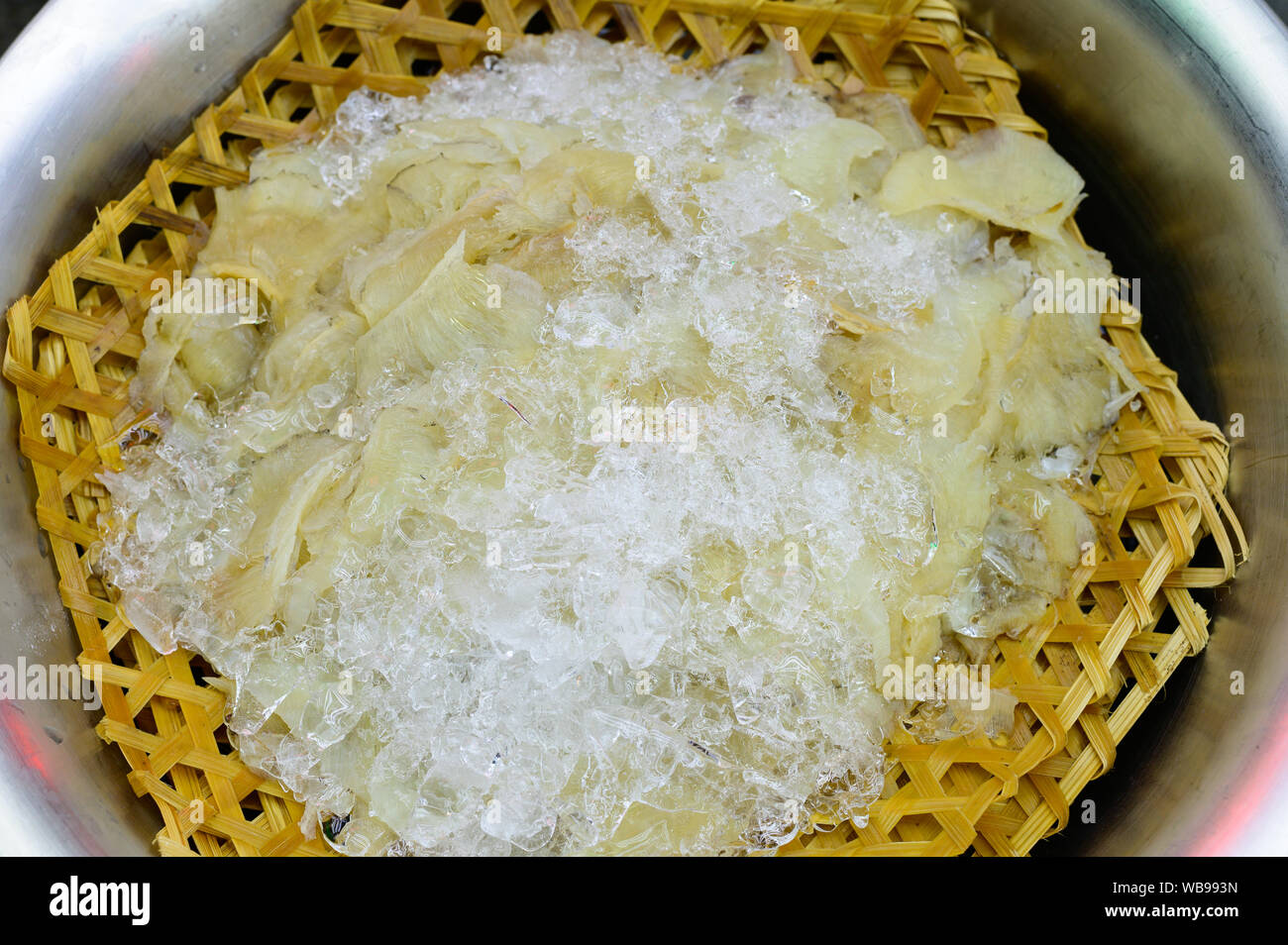 Many shark fins in bamboo plate for sale in market Stock Photo - Alamy