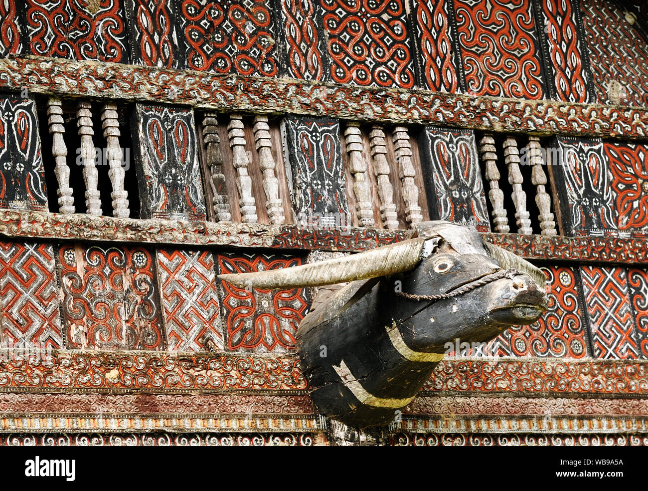 Traditional sweeping and elaborately painted houses with boat-shaped ...