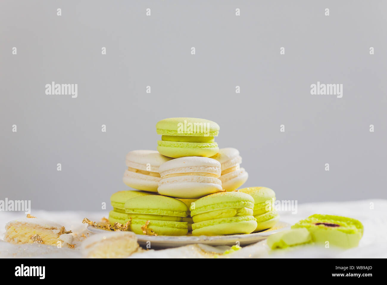 Many colorful macaroons on white ceramics plate over the table Stock ...