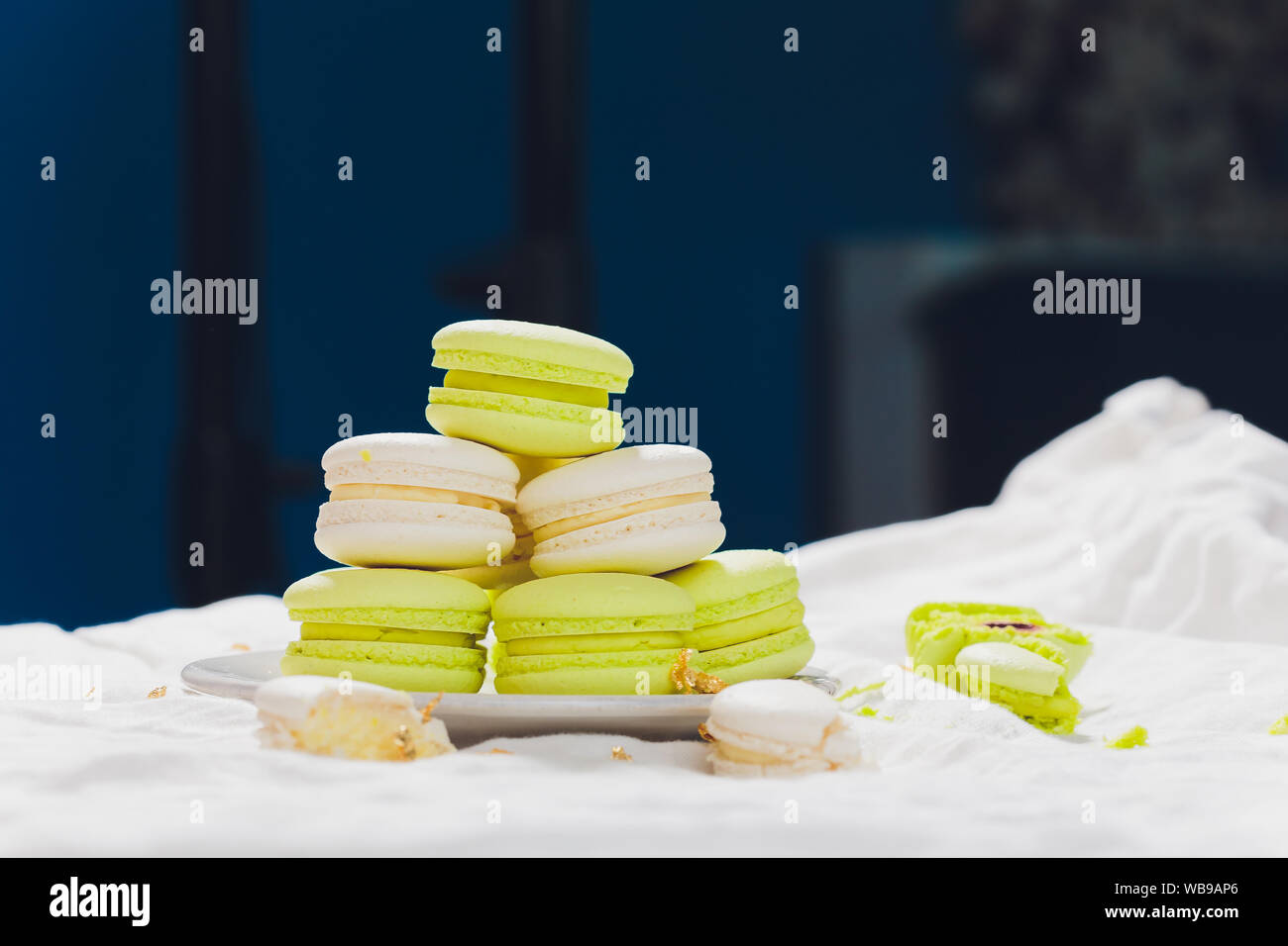 Many colorful macaroons on white ceramics plate over the table Stock ...